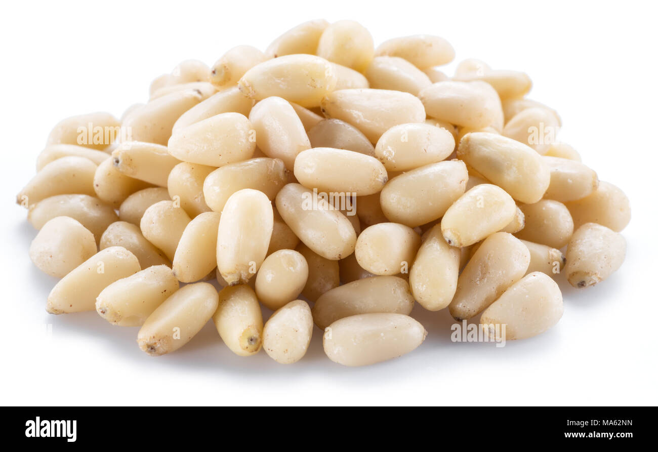 Pine nuts on the white background. Organic food Stock Photo - Alamy