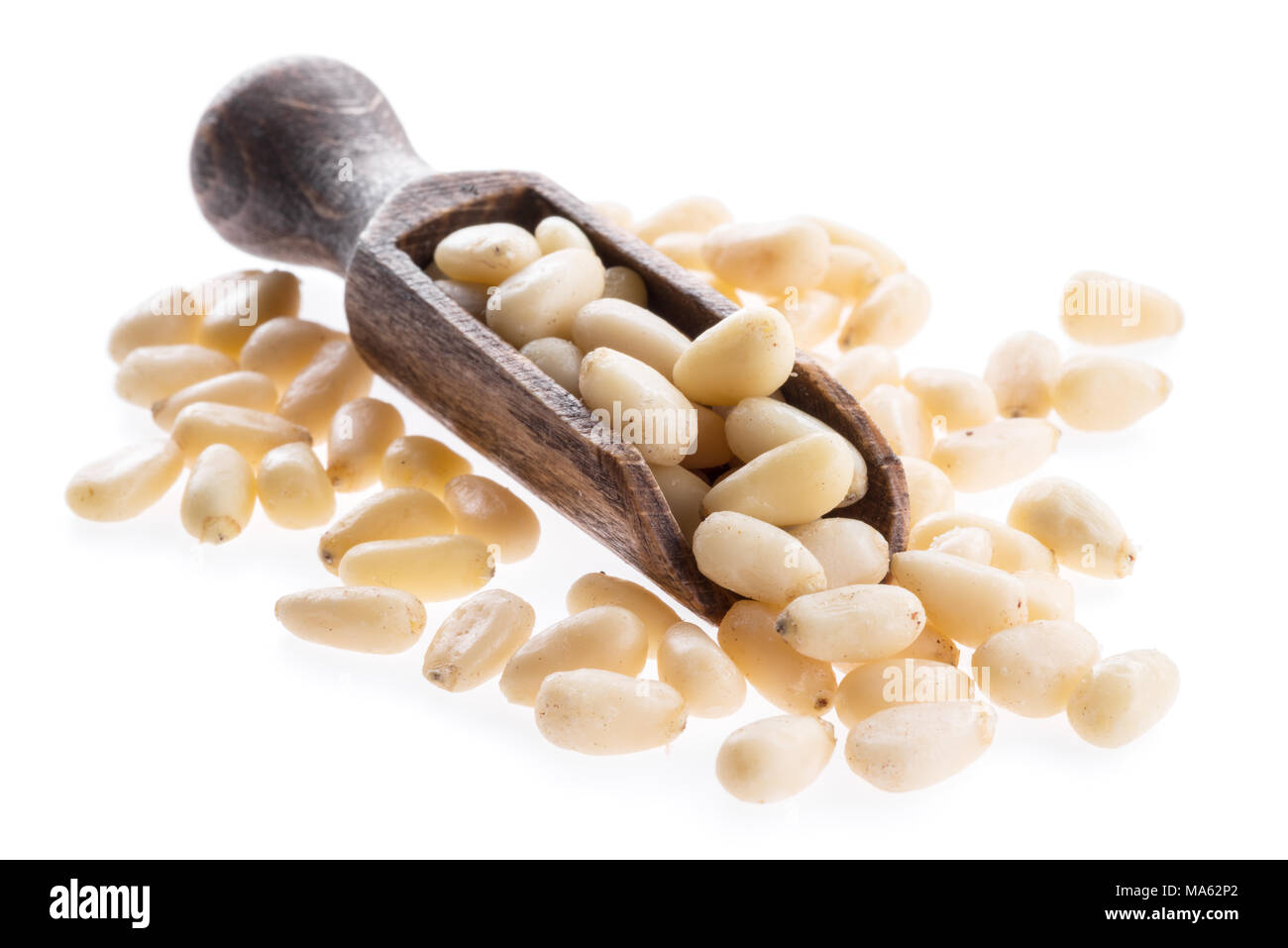 Pine nuts in the wooden scoop. White background Stock Photo - Alamy
