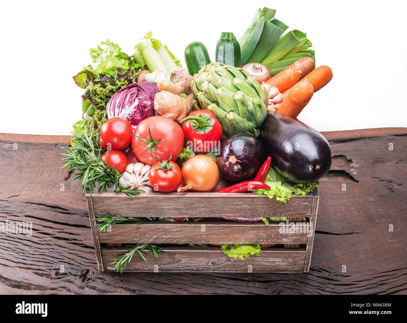 Fresh multi-colored vegetables in wooden crate Stock Photo - Alamy