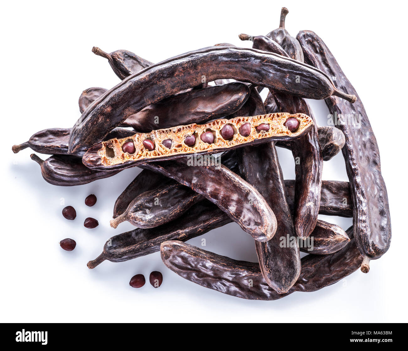 Carob pods and carob powder on the white background Stock Photo - Alamy
