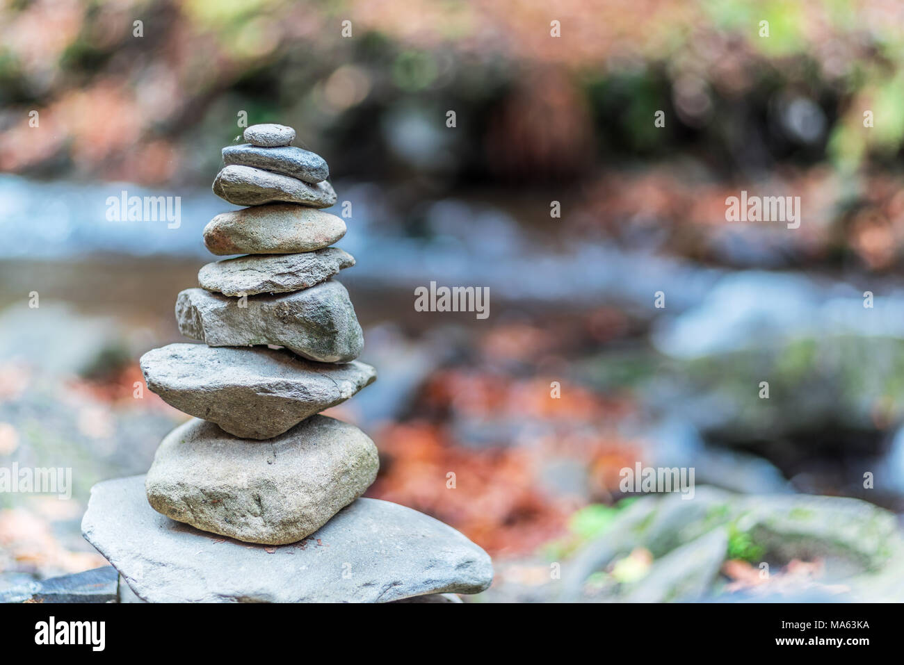 Balanced stones or stone pyramid on the river bank Stock Photo - Alamy
