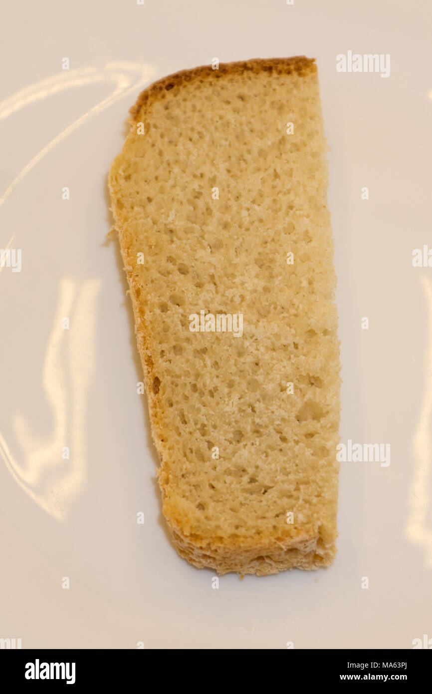 Close-up image of one slice of white bread against the white background ...