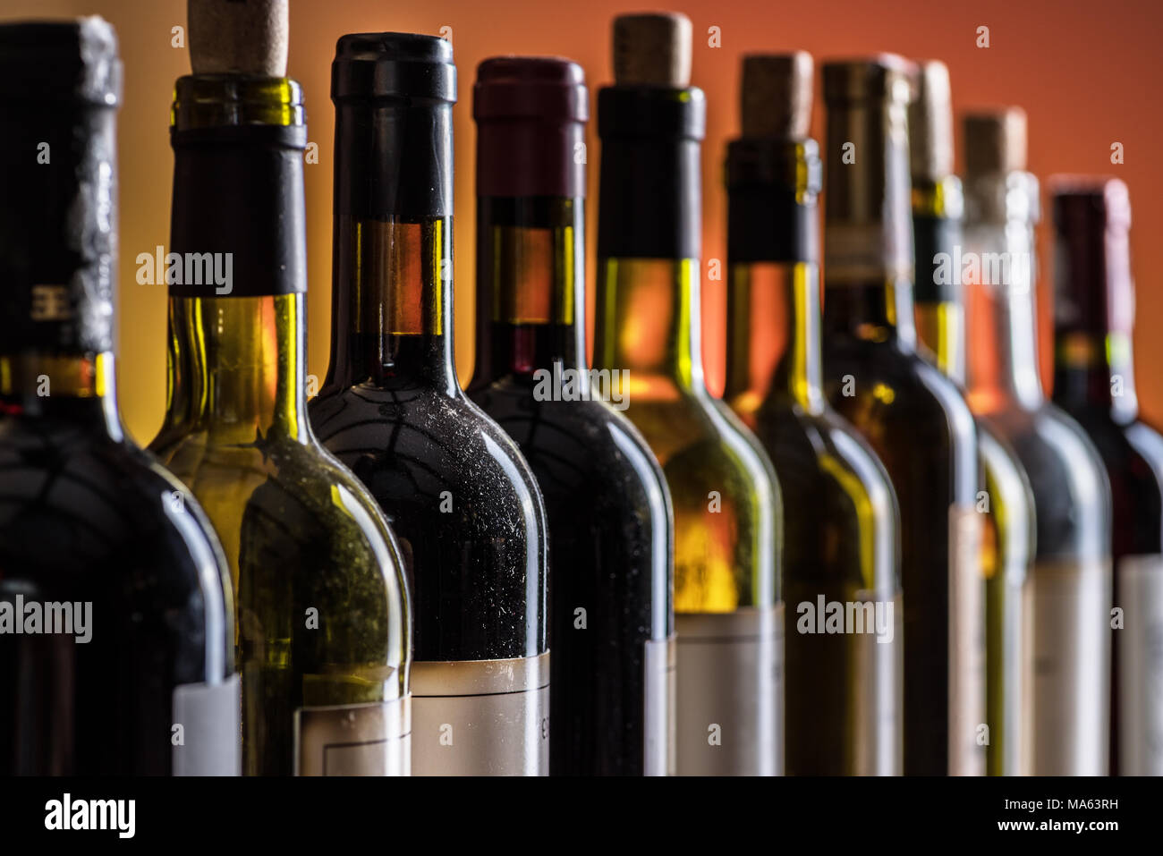 Line of wine bottles. Close-up Stock Photo - Alamy