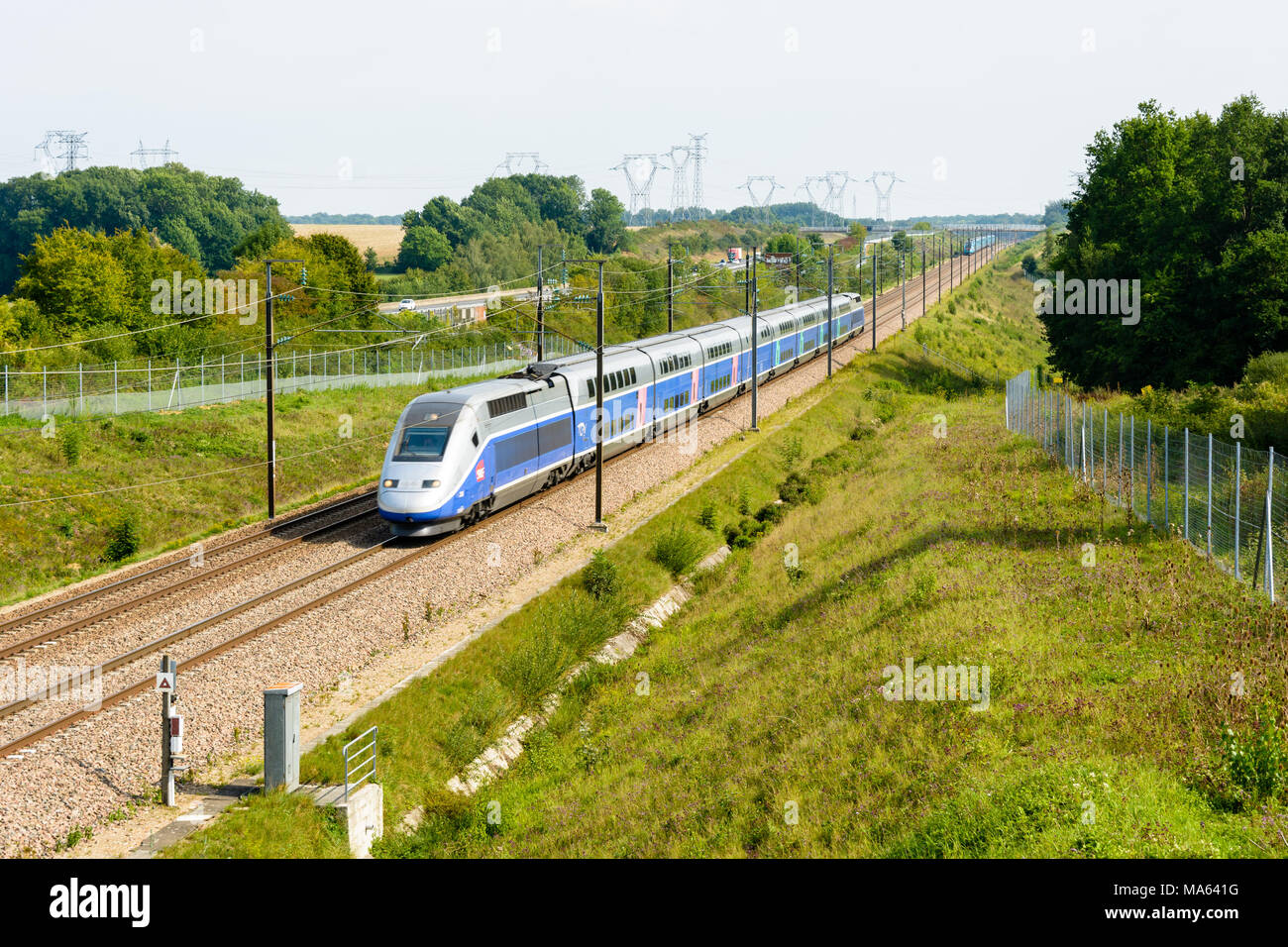 A double-decker high-speed TGV Duplex train in Atlantic livery from french company SNCF, driving ...