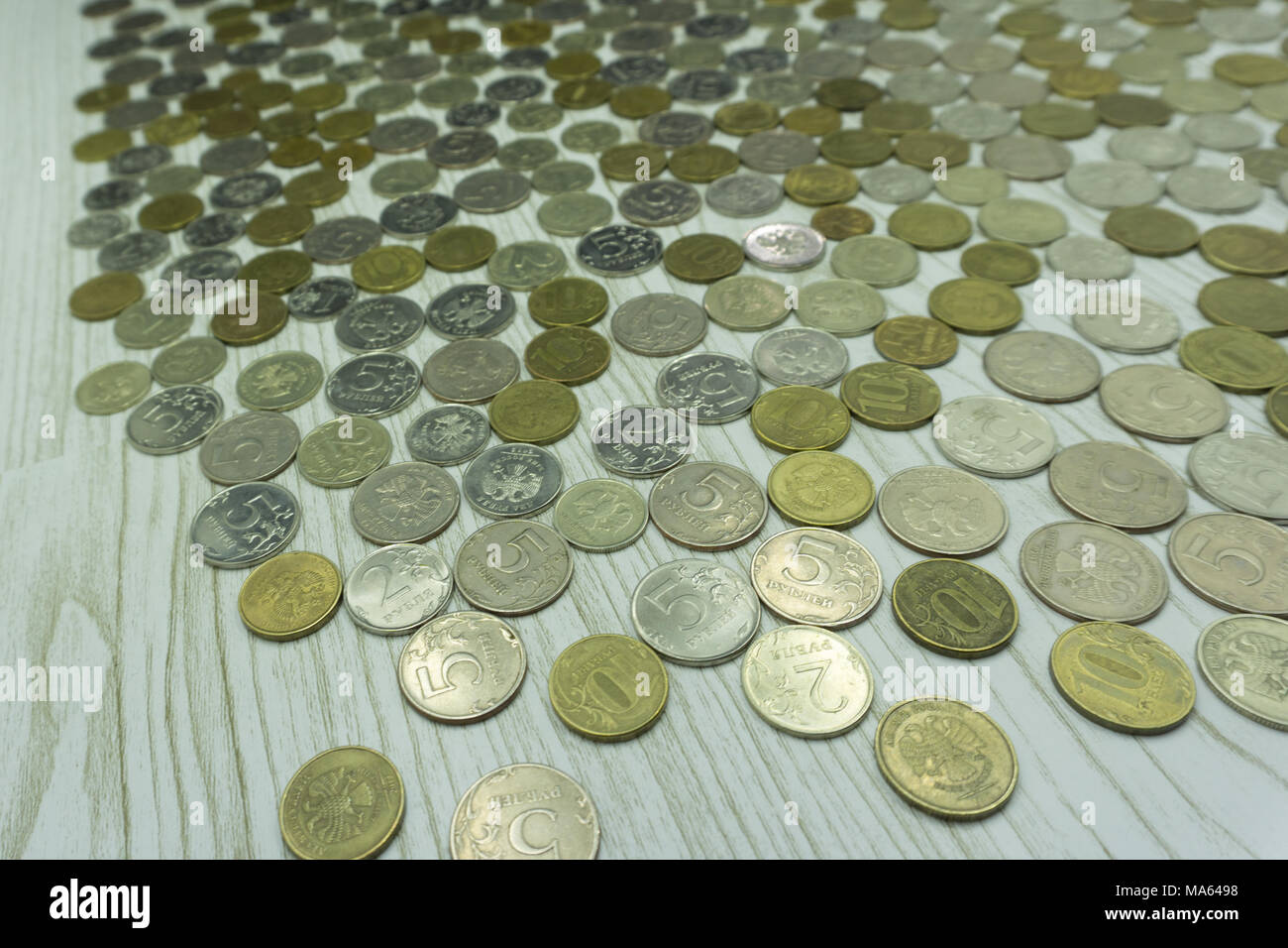 piled coins purchase rich sale save sell Stock Photo - Alamy