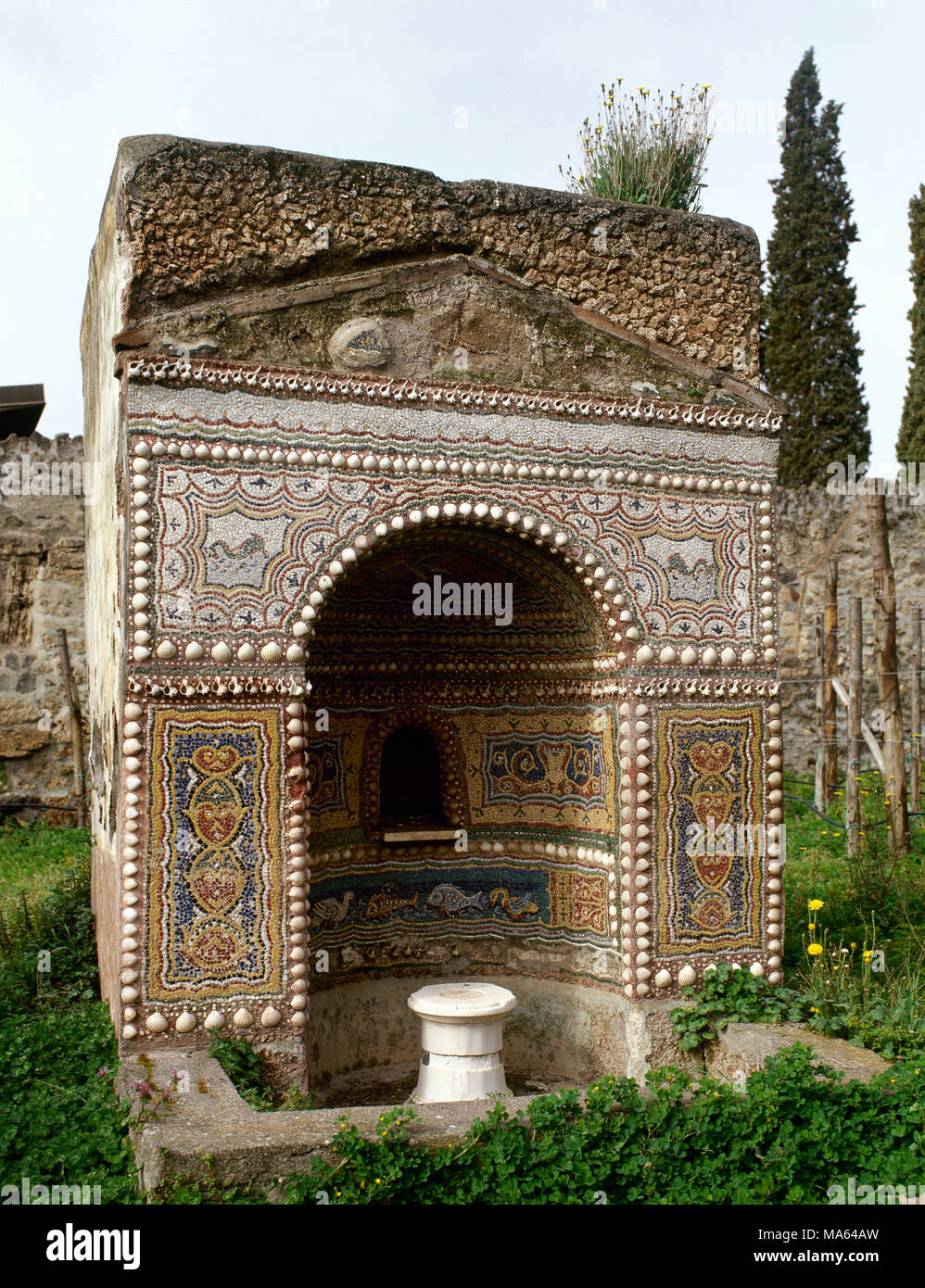 Pompeii. Ancient Roman city. Niche decorated with mosaics in a garden ...
