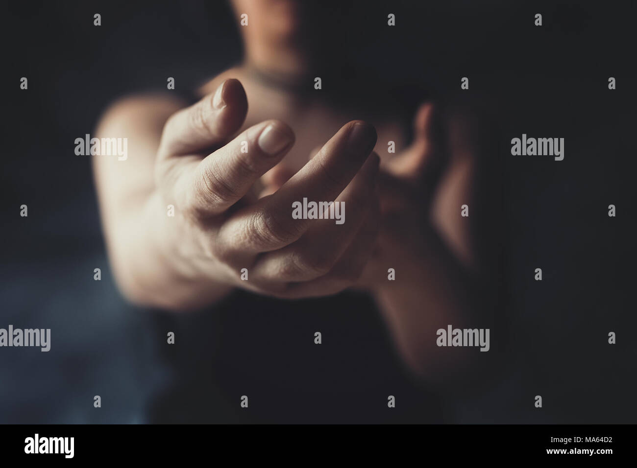 Hand Reaching Out Of Darkness