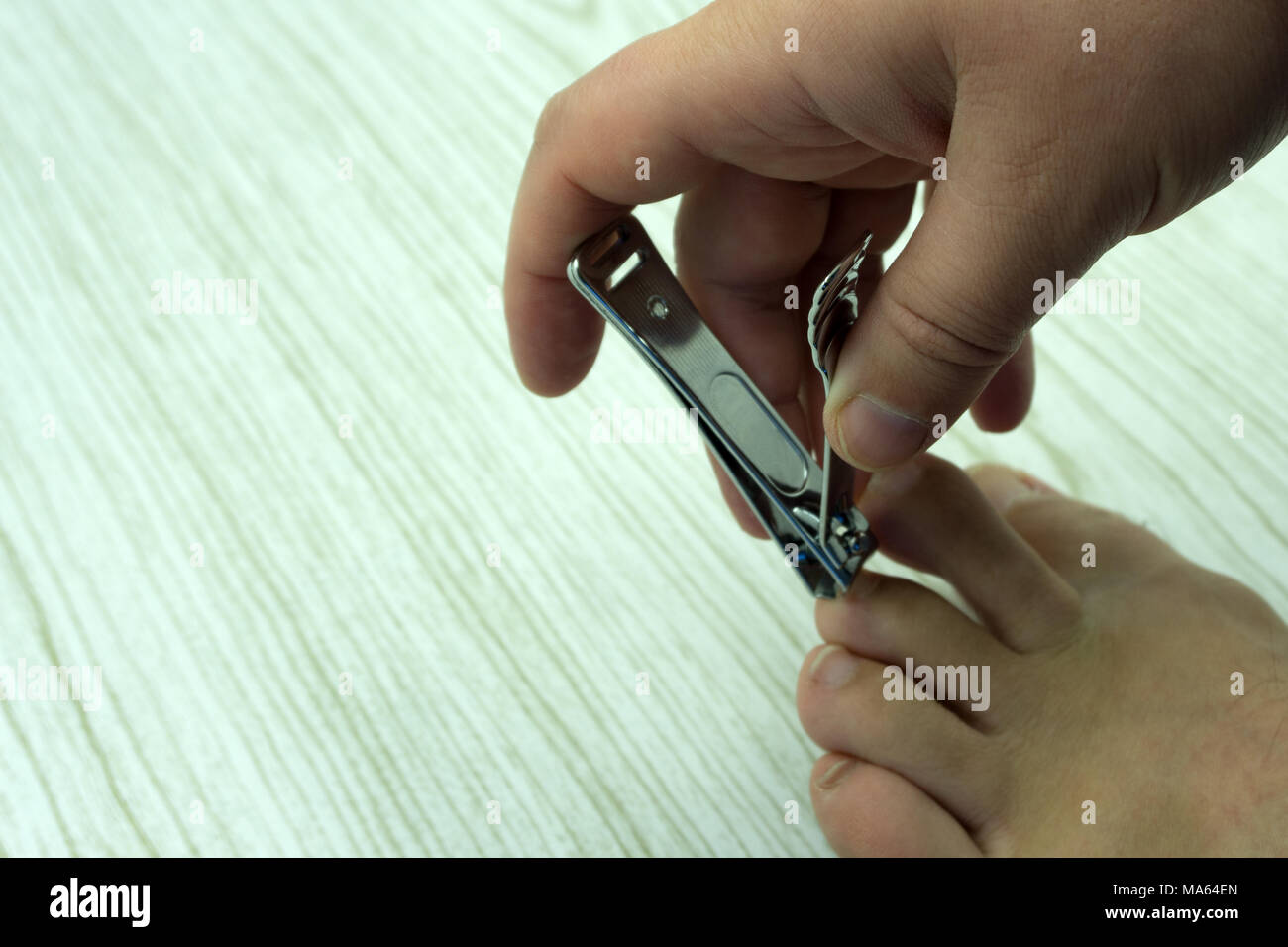 Finger nail clippings in palm of hand isolated background Stock Photo ...