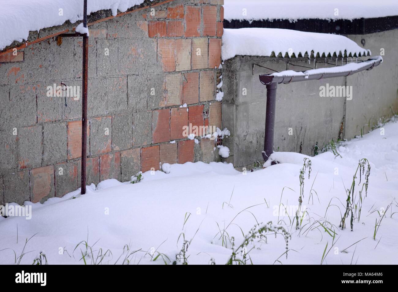 Brick wall and snowy path (Pesaro, Italy Stock Photo - Alamy