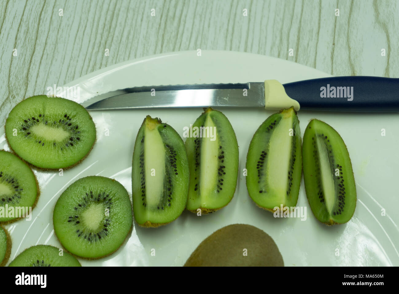 Isolated kiwi. Collection of whole and cut kiwi fruits isolated on ...