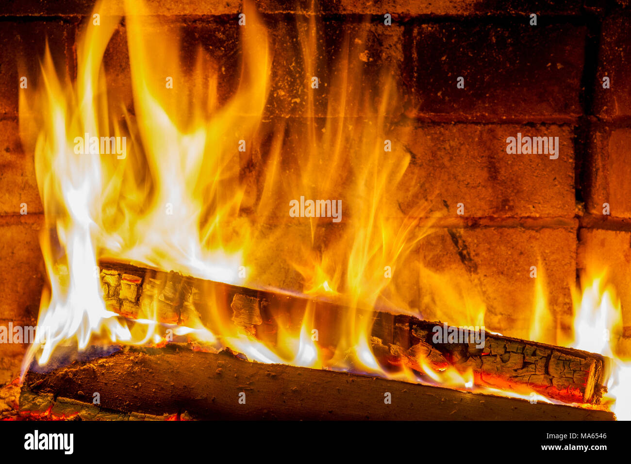 Burning and glowing pieces of wood in Fireplace Stock Photo - Alamy