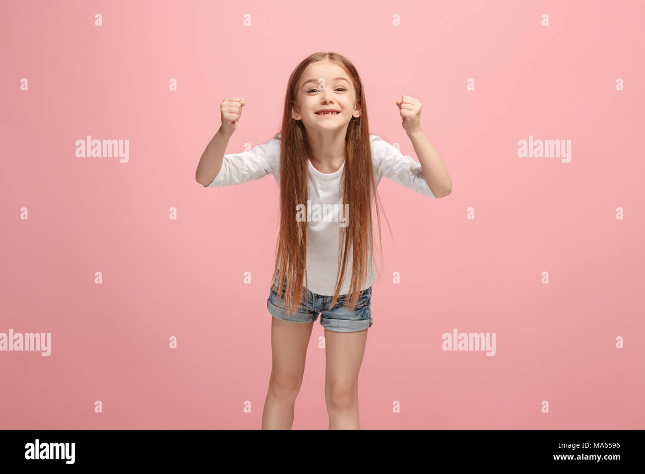 Happy success teen girl celebrating being a winner. Dynamic energetic ...