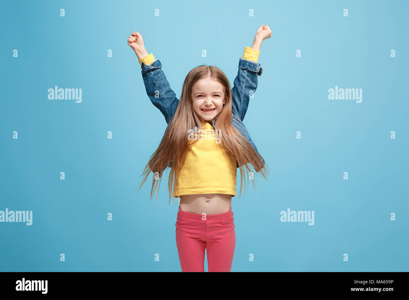 Happy success teen girl celebrating being a winner. Dynamic energetic ...