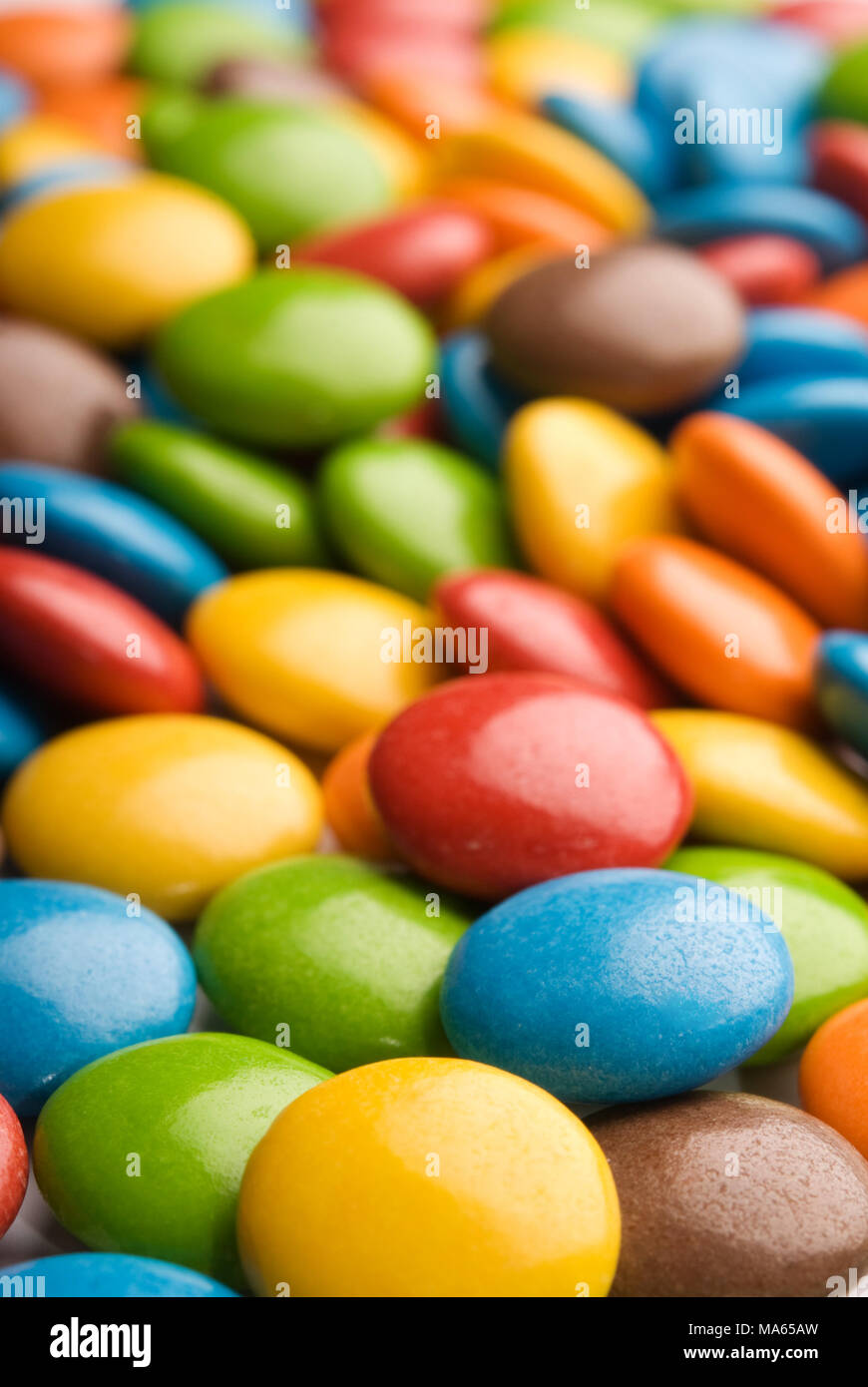 colorful candies on a white background Stock Photo - Alamy
