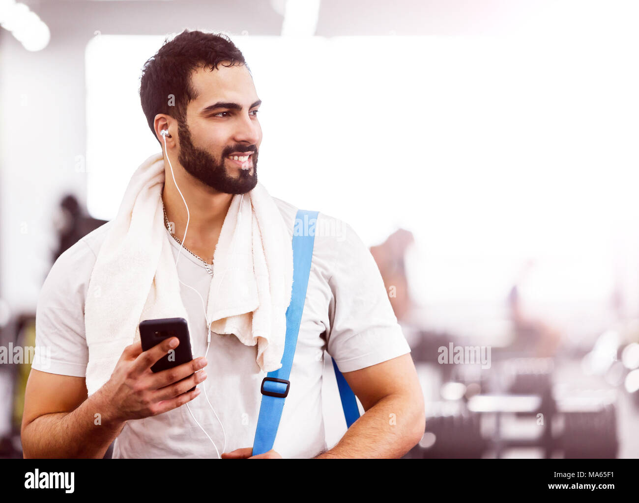 Man in the Gym with Phone Stock Photo - Alamy