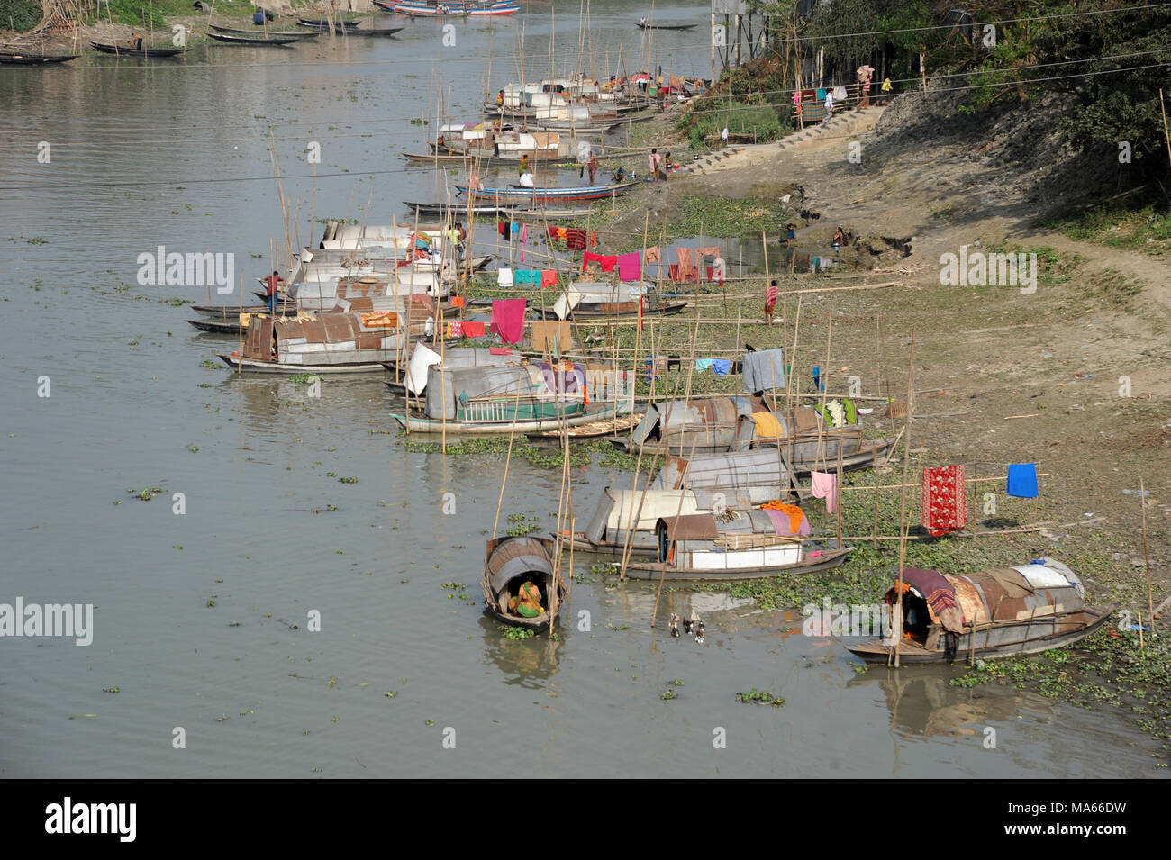 Dhaka, Bangladesh - February 02, 201: A bunch of narrow boats floating ...