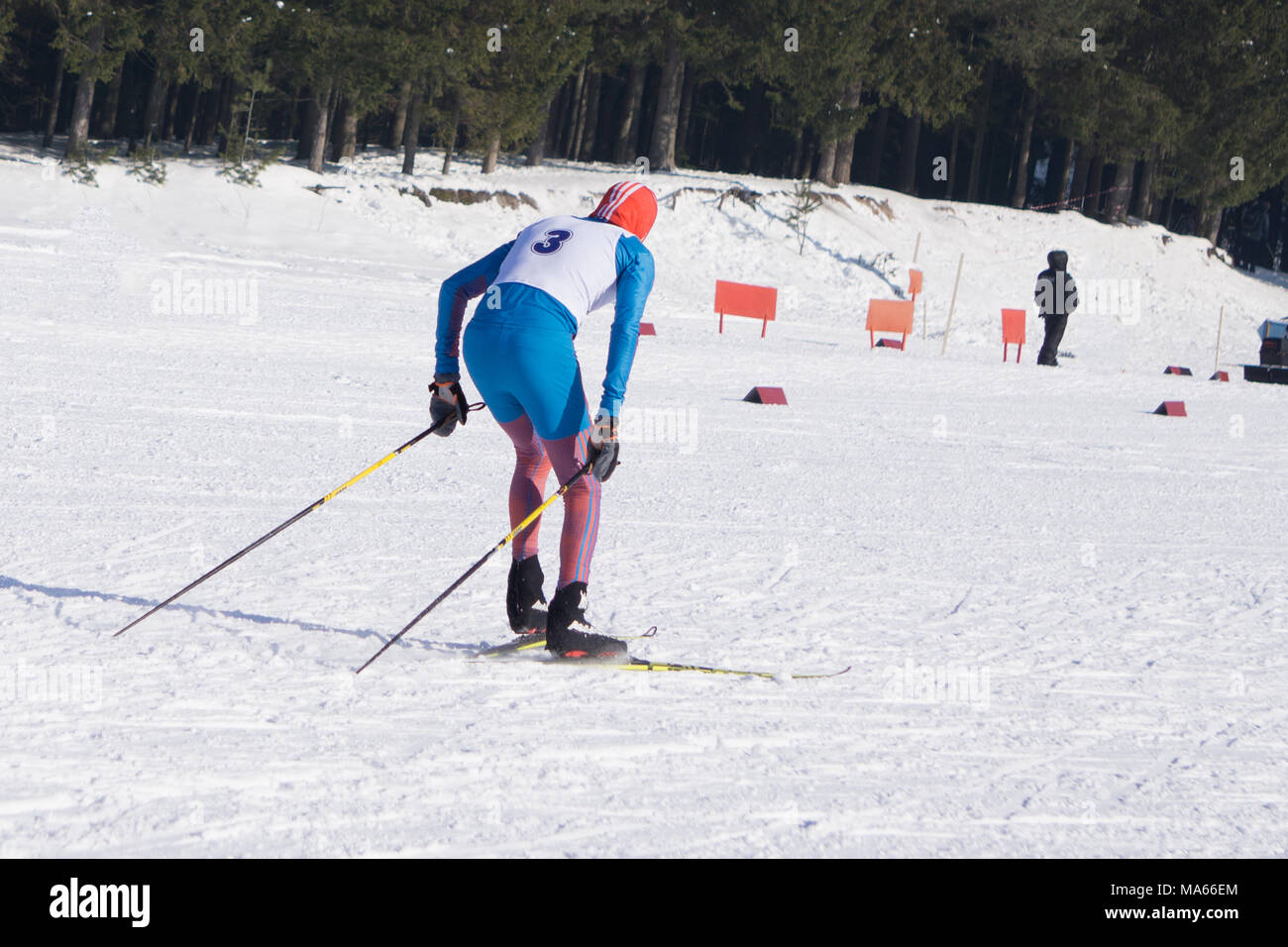 Professional skier jumping in the air while skiing in the mountains ...