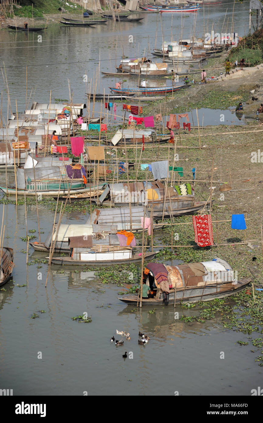 Dhaka, Bangladesh - February 02, 201: A bunch of narrow boats floating ...