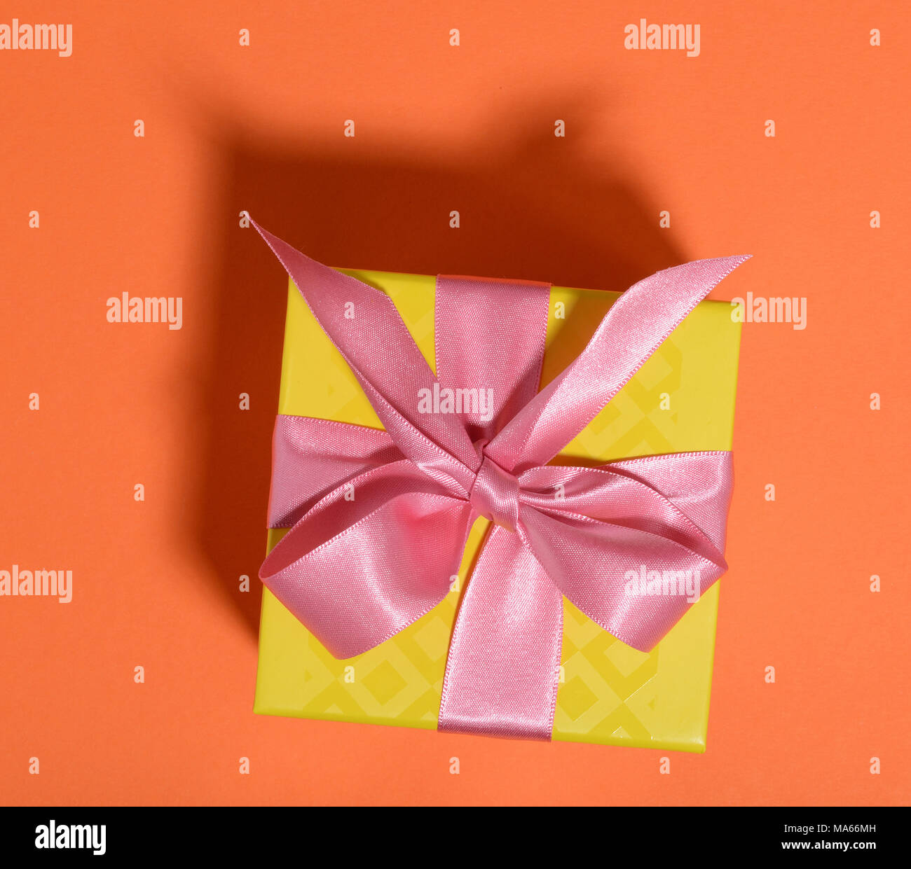 Gift box with tied ribbon bow Stock Photo - Alamy