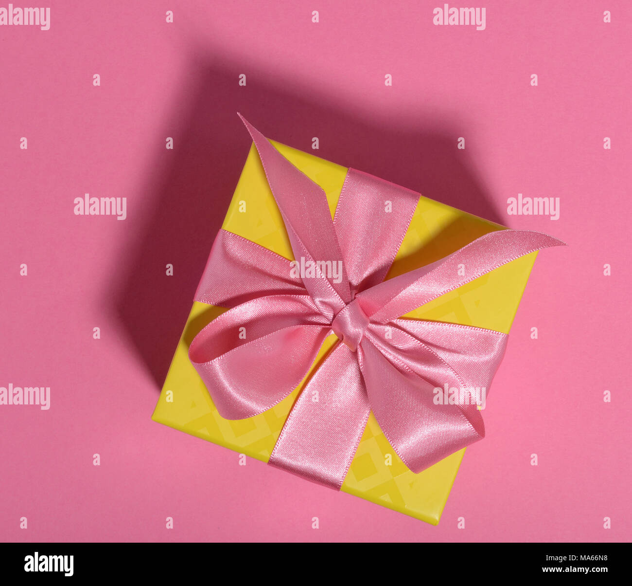 Gift box with tied ribbon bow Stock Photo - Alamy