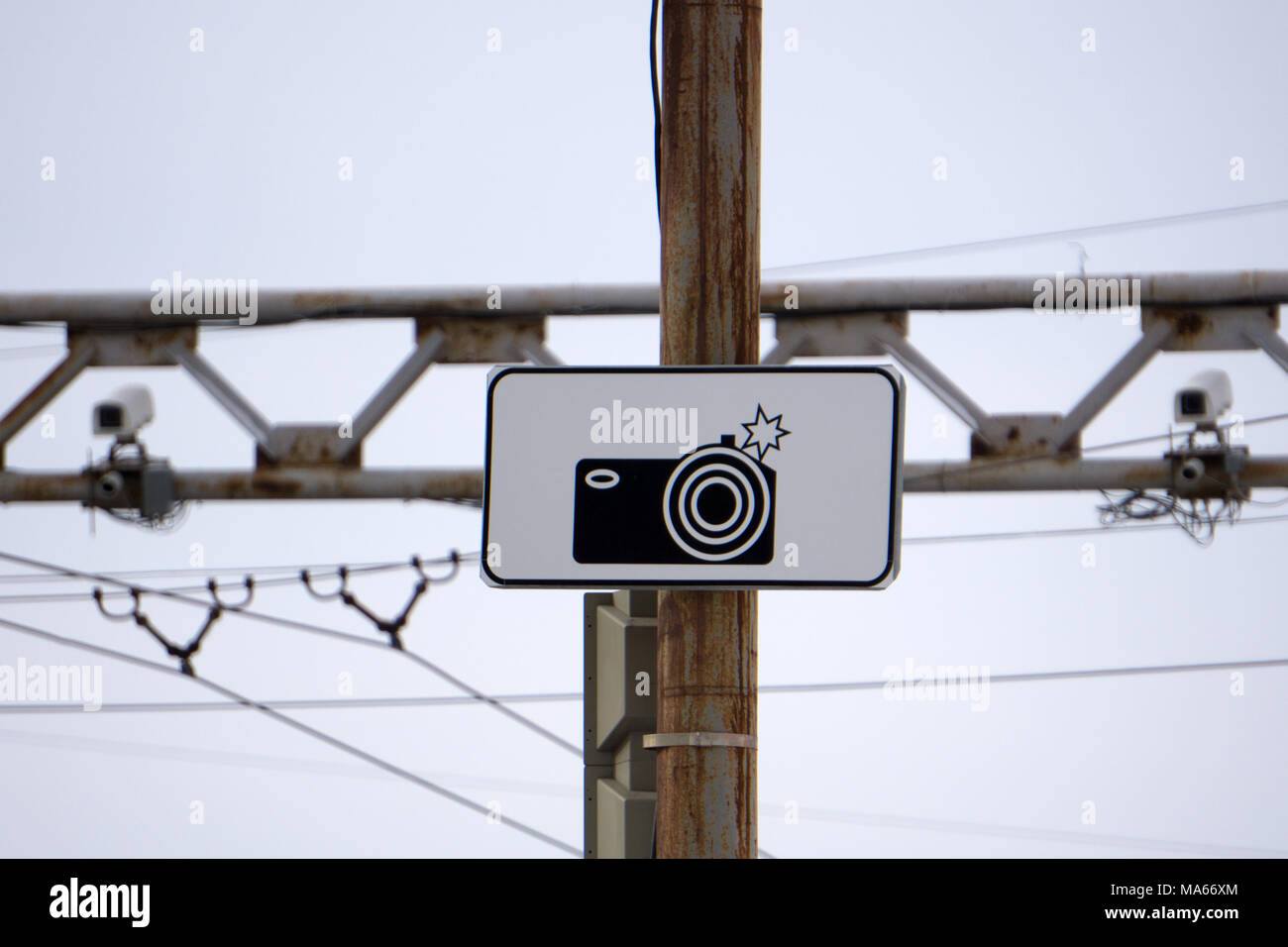 Speed camera sign isolated on white Stock Photo - Alamy