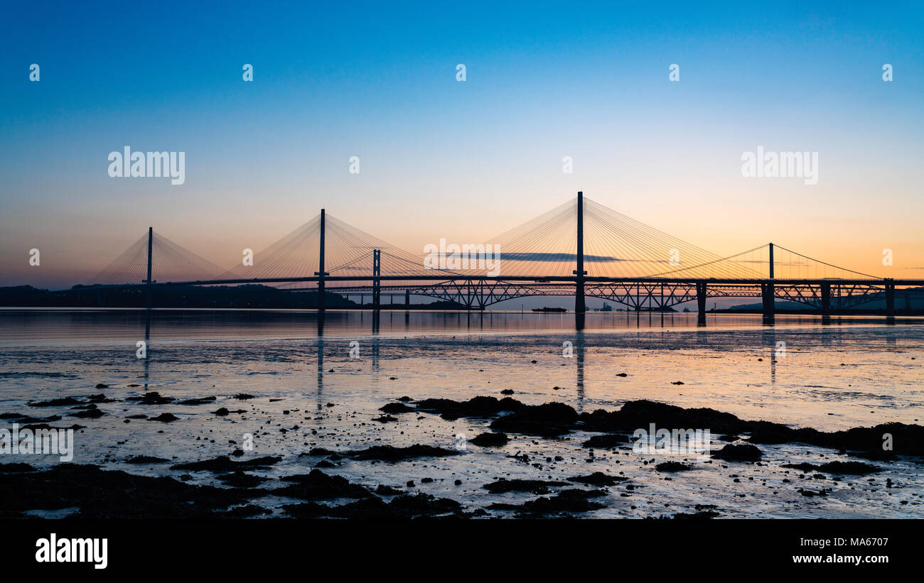 Sunrise view of the three major bridges crossing the Firth of Forth at ...