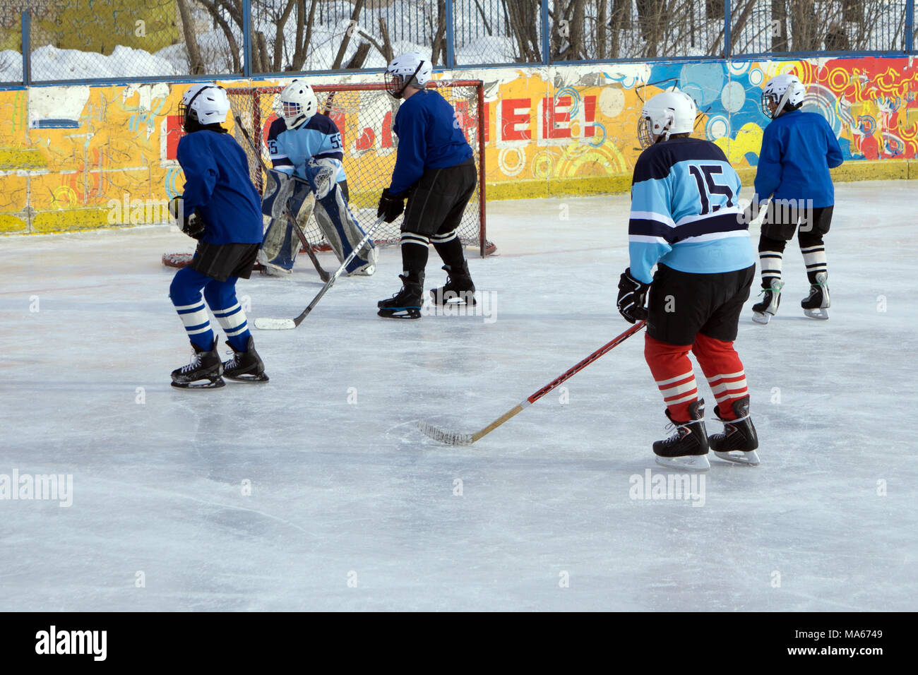 ice hockey player in action kicking with stick Stock Photo - Alamy