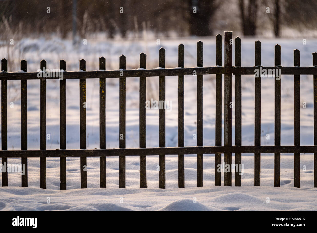 wooden plank fence details in countryside in winter time, with lots of ...