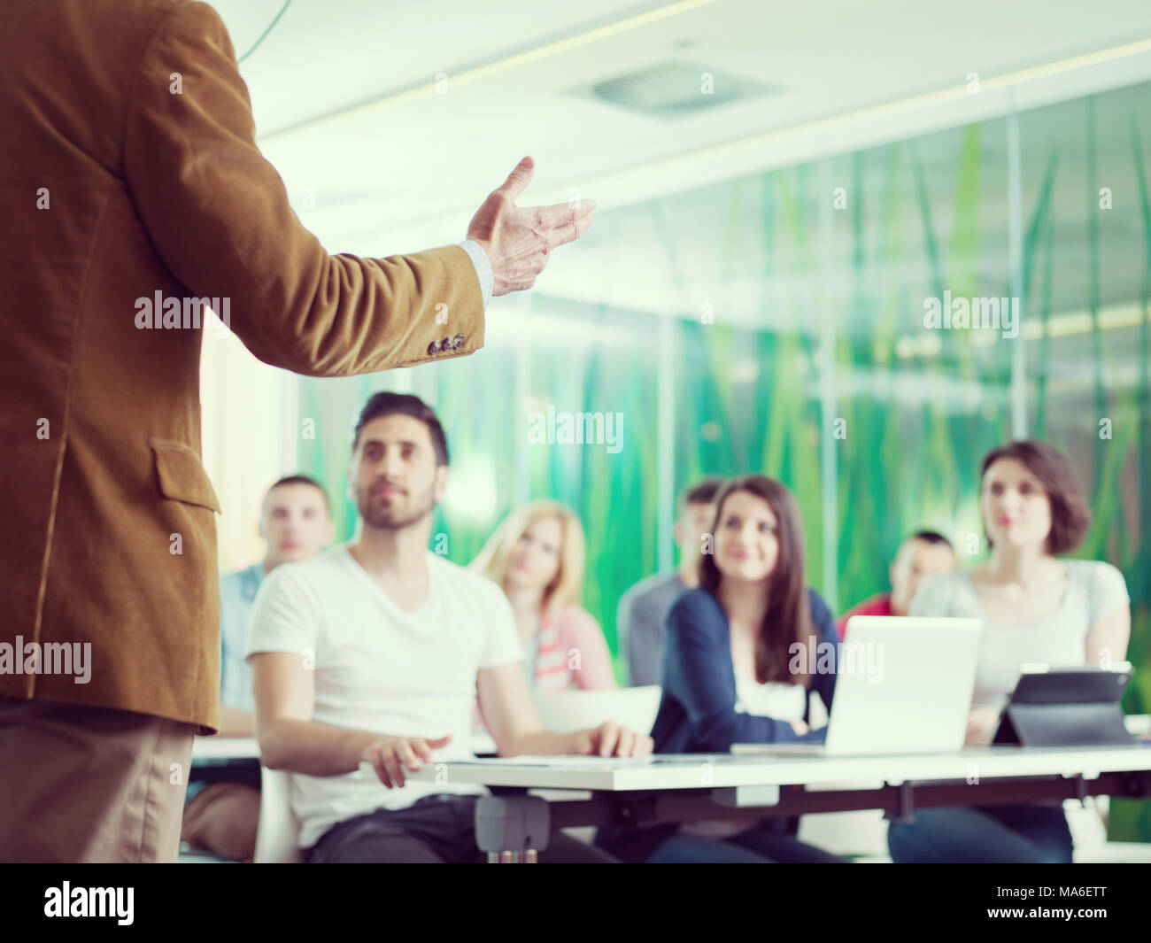 close up of teacher hand with marker while teaching lessons in school ...