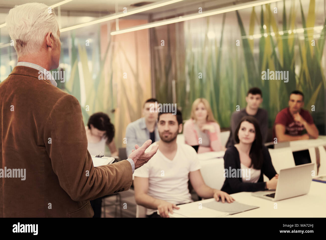 group of students study with professor in modern school classroom Stock ...