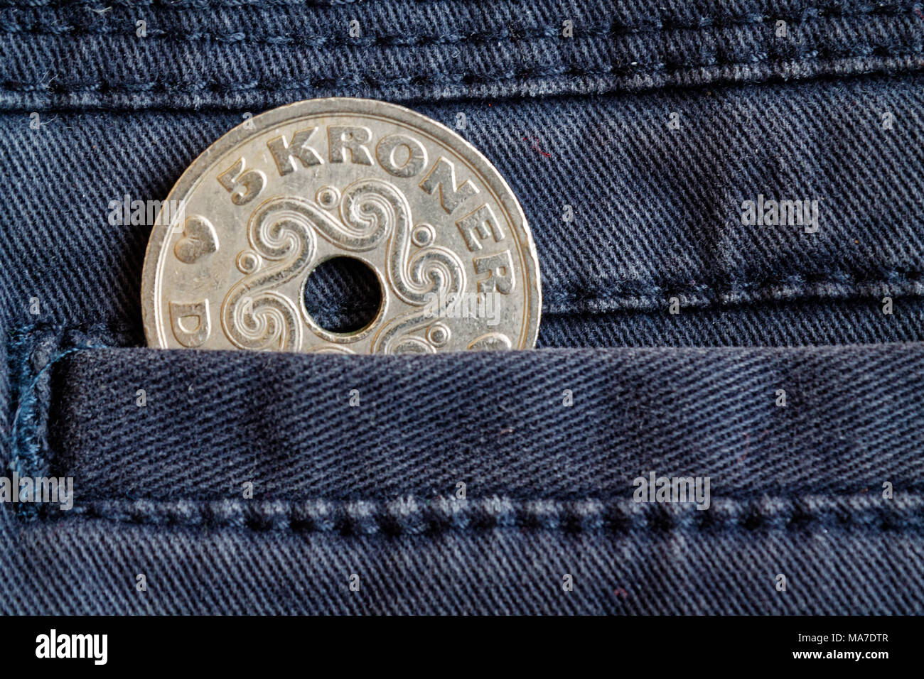 Denmark coin denomination is five krone (crown) in the pocket of dark ...