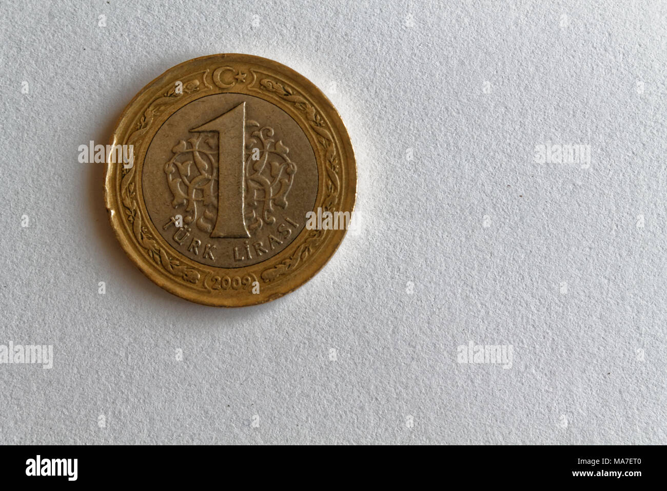 One Turkish coin denomination is 1 lira lie on isolated white ...