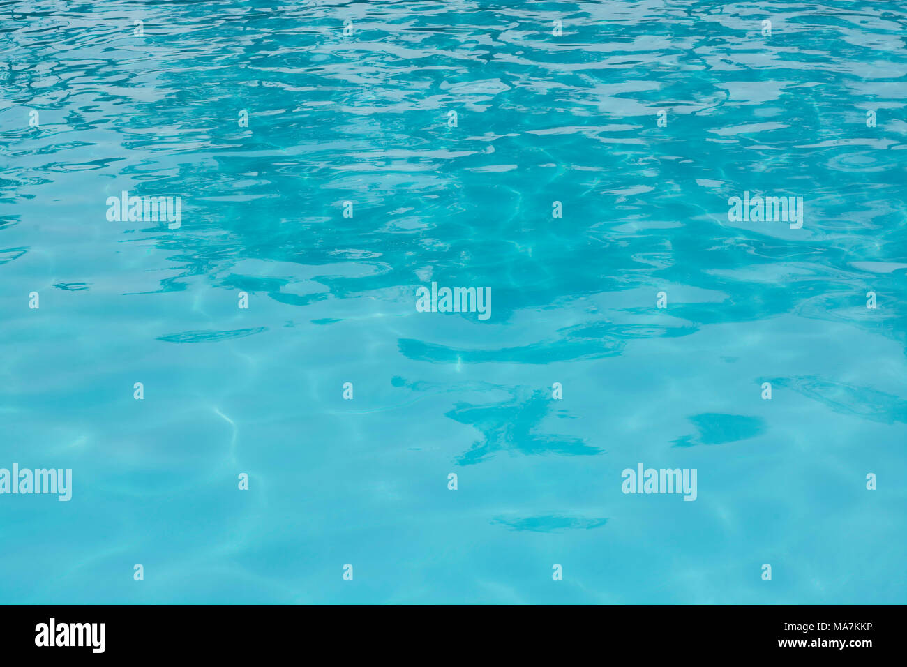 Swimming pool blue water with bright sun light reflections Stock Photo ...