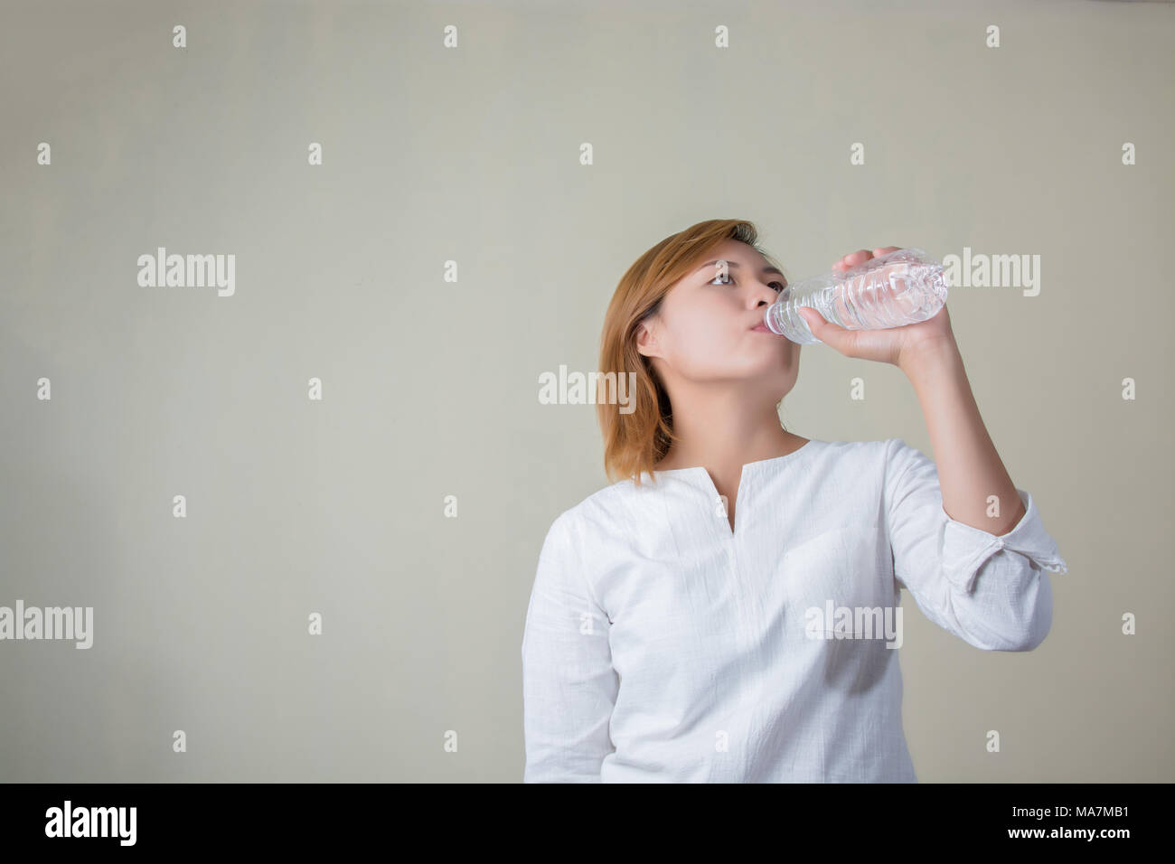 Young woman drinking water look so fresh Stock Photo - Alamy