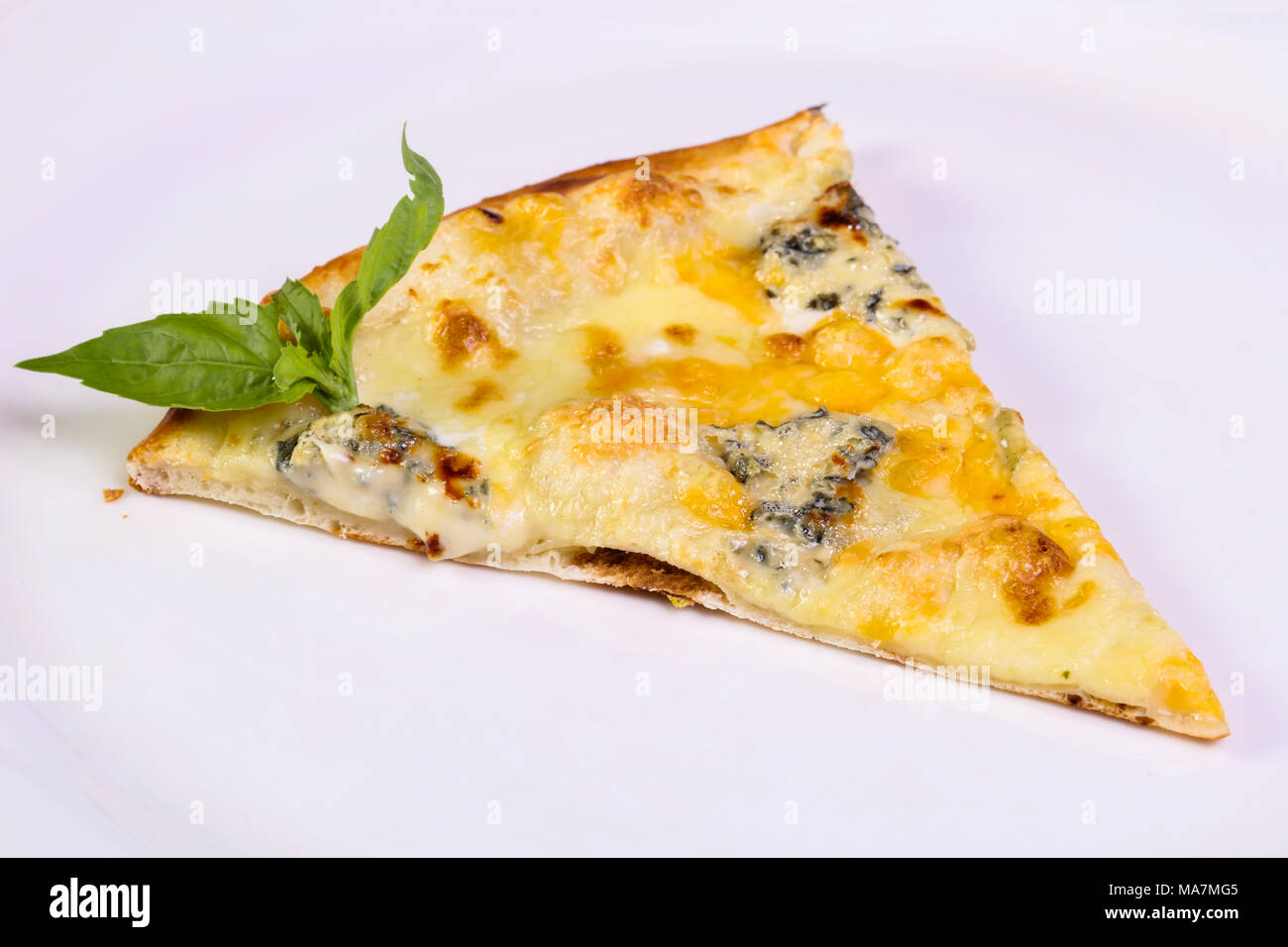 Four cheese pizza served basil Stock Photo - Alamy