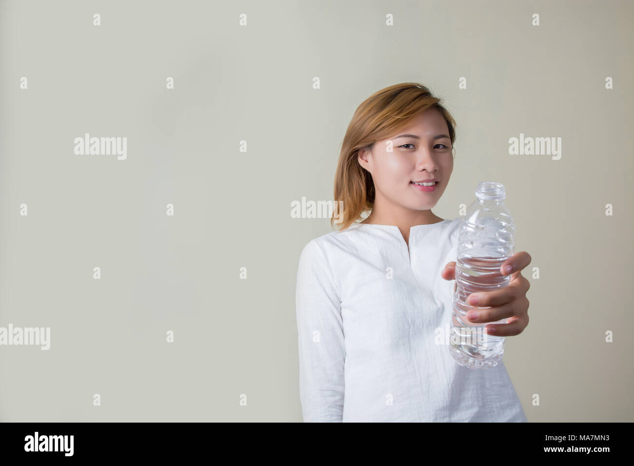 Young woman drinking water look so fresh Stock Photo - Alamy