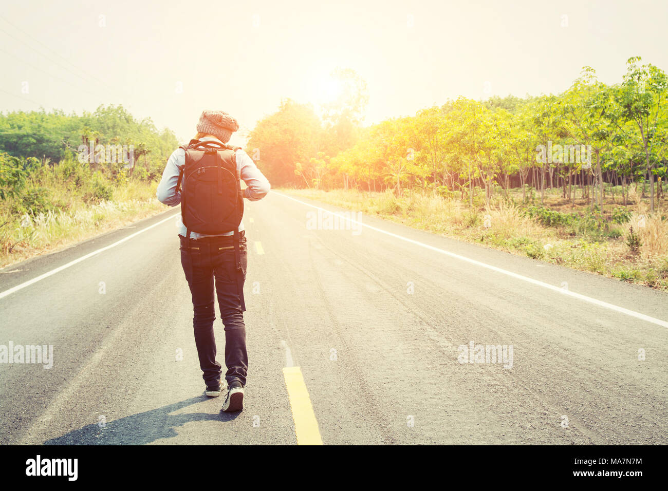 Woman traveler carrying backpack walking hi-res stock photography and ...