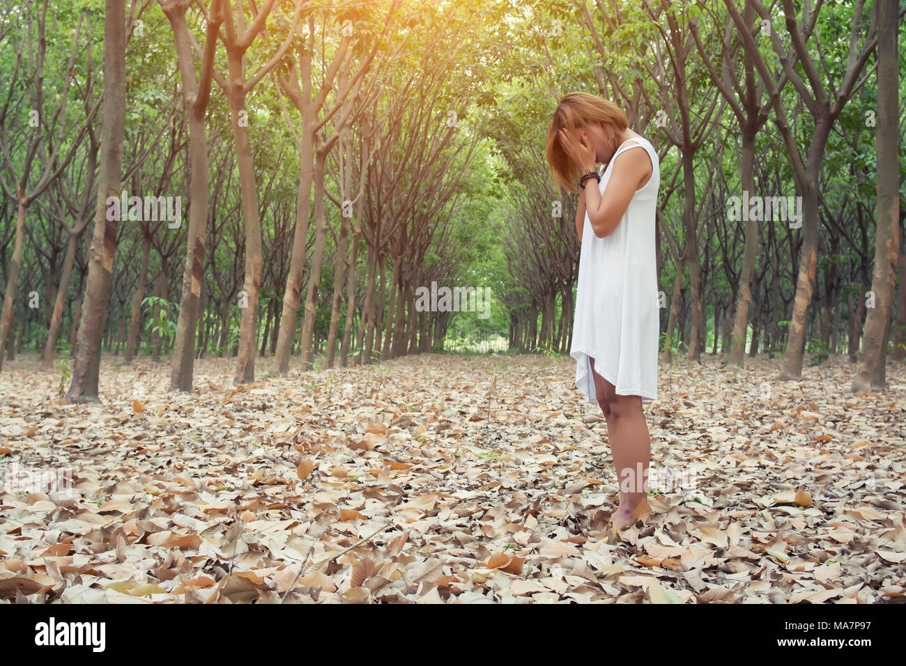 sad unhappy woman in the green forest, stress, depression Stock Photo ...