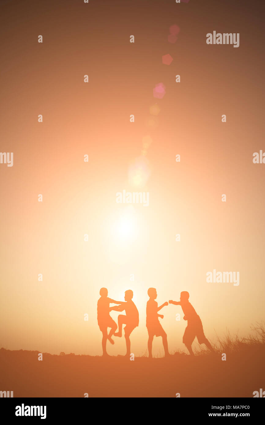 Children playing on summer sunset happy time Stock Photo - Alamy