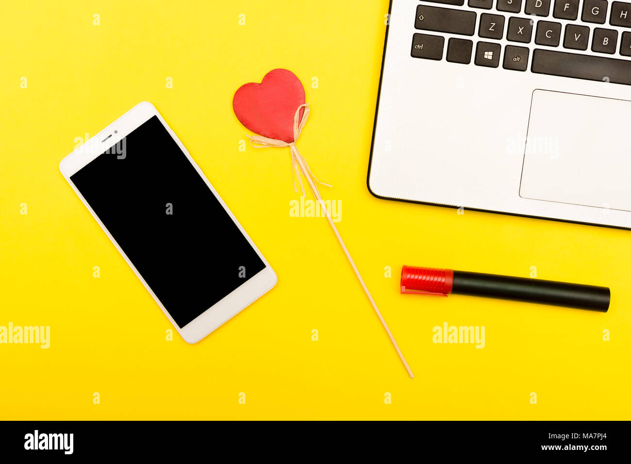 Heart Mobile Computer. The concept of love for new gadgets Stock Photo ...