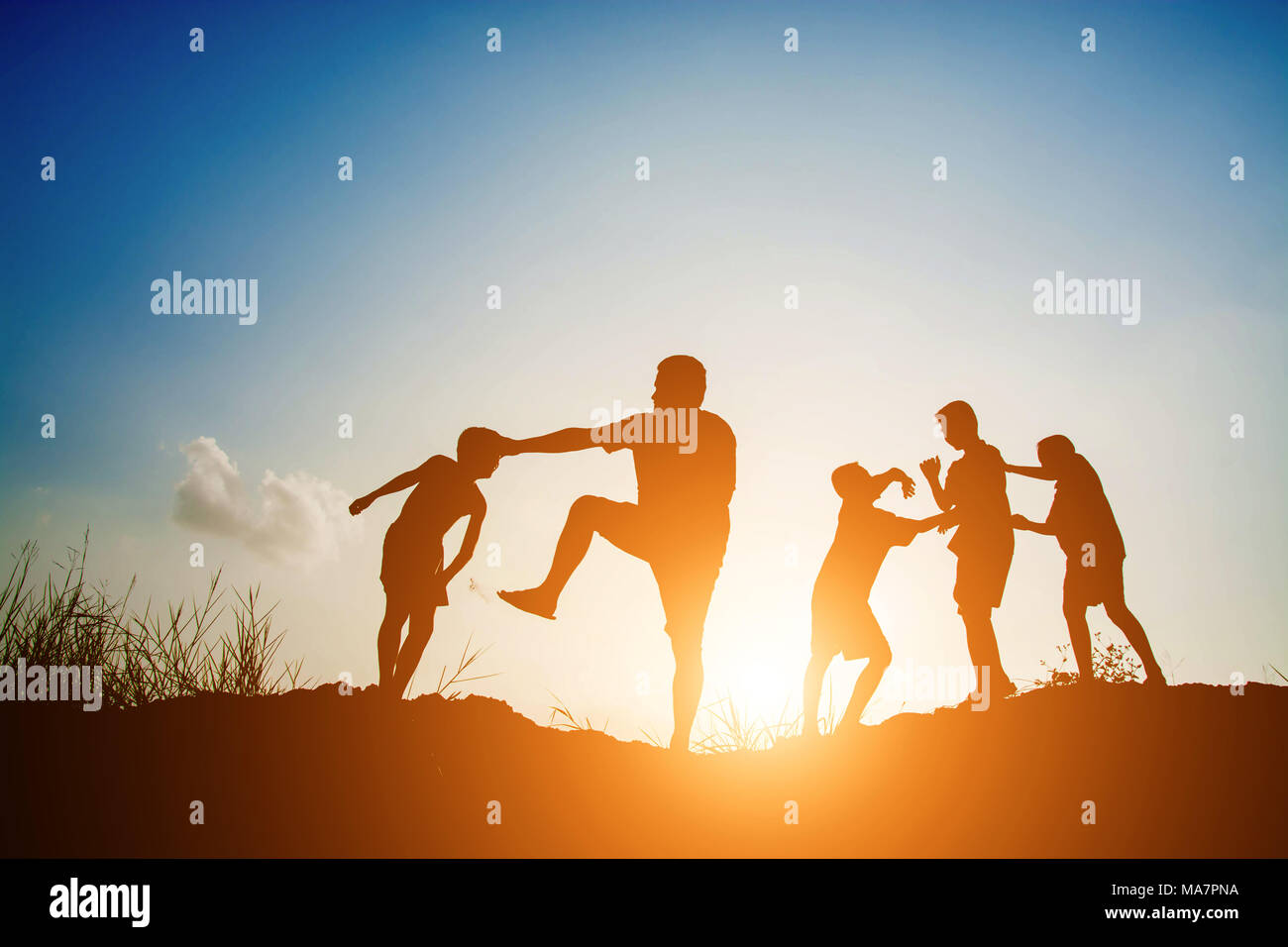 Children playing on summer sunset happy time Stock Photo - Alamy