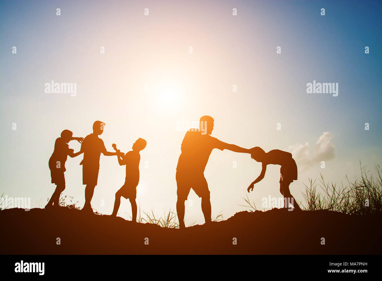 Children playing on summer sunset happy time Stock Photo - Alamy