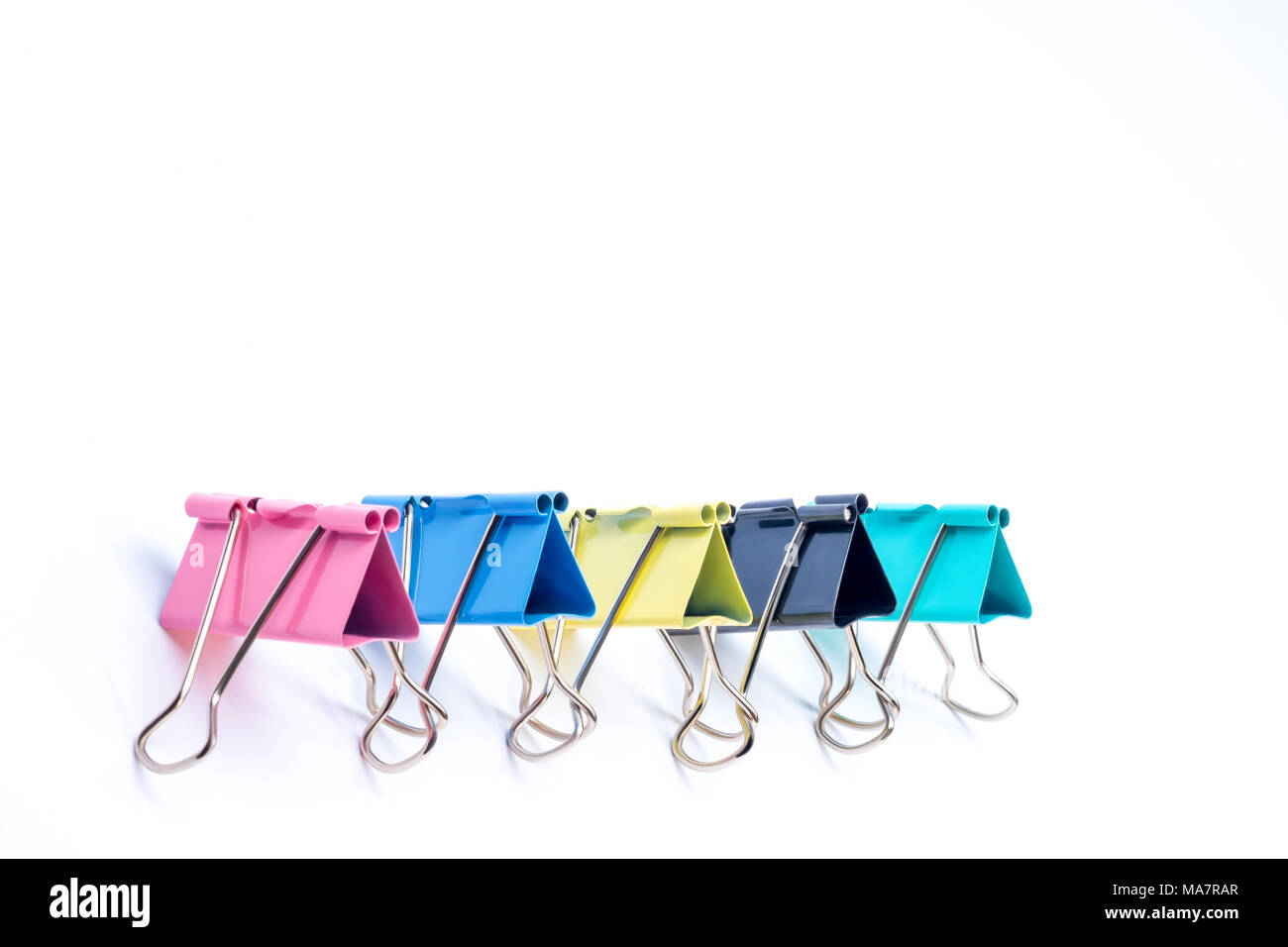 Creative stationery composition. Binder clips on white background ...