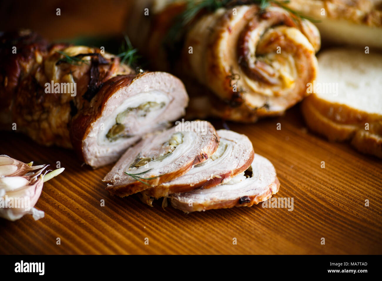Roll of meat with various spices and herbs Stock Photo - Alamy