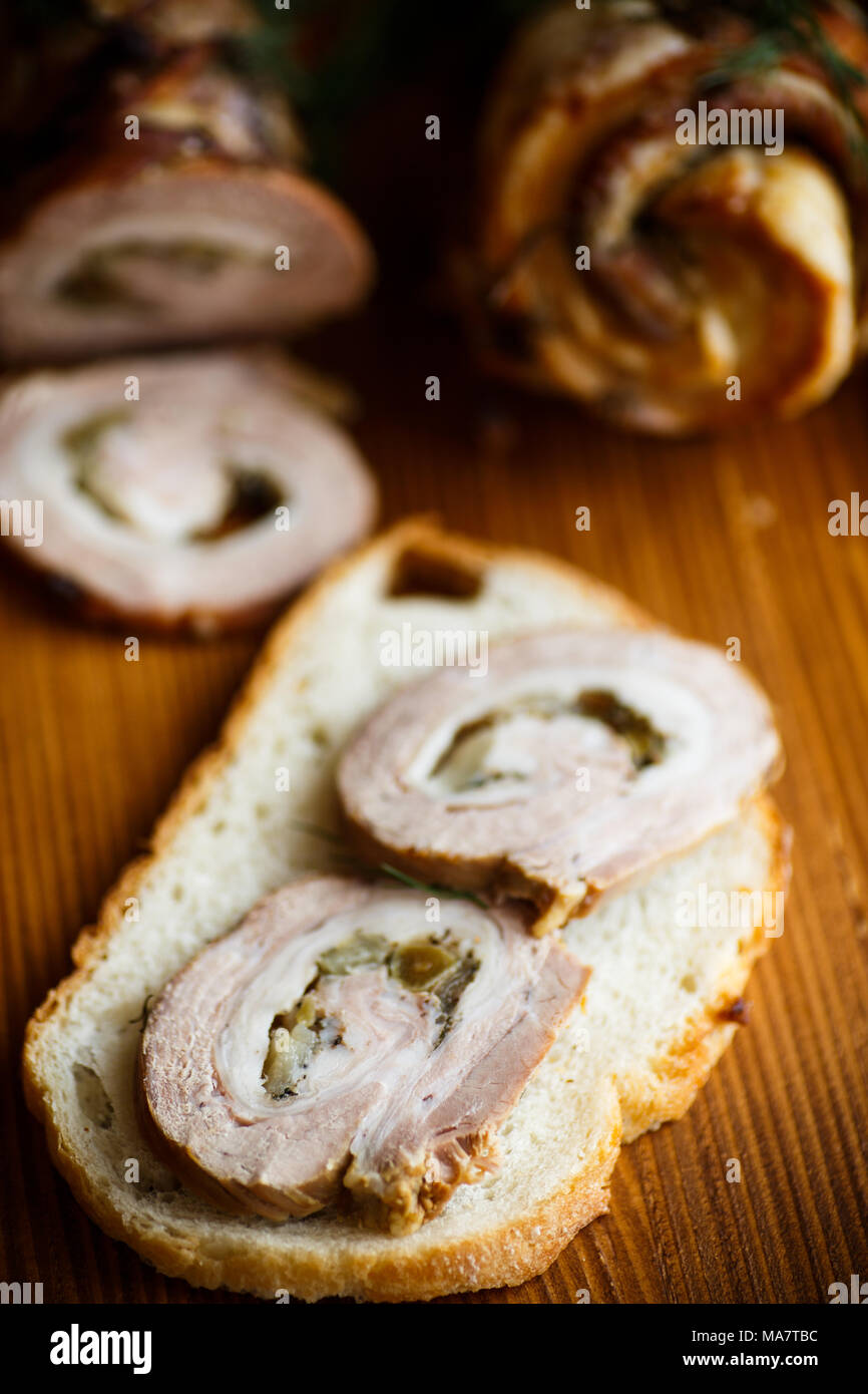 Roll of meat with various spices and herbs Stock Photo - Alamy