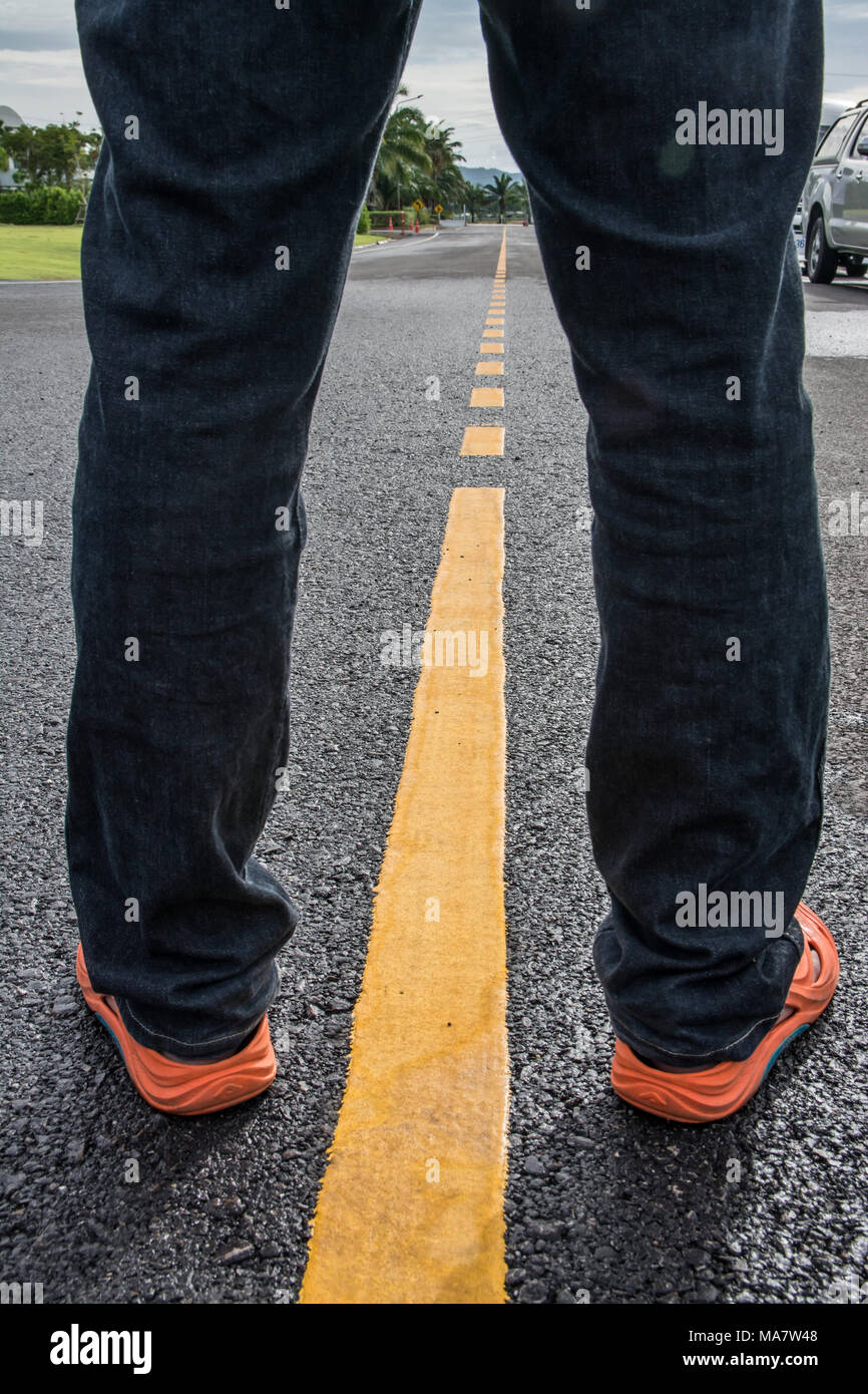 Man feet walking on road walk Stock Photo - Alamy