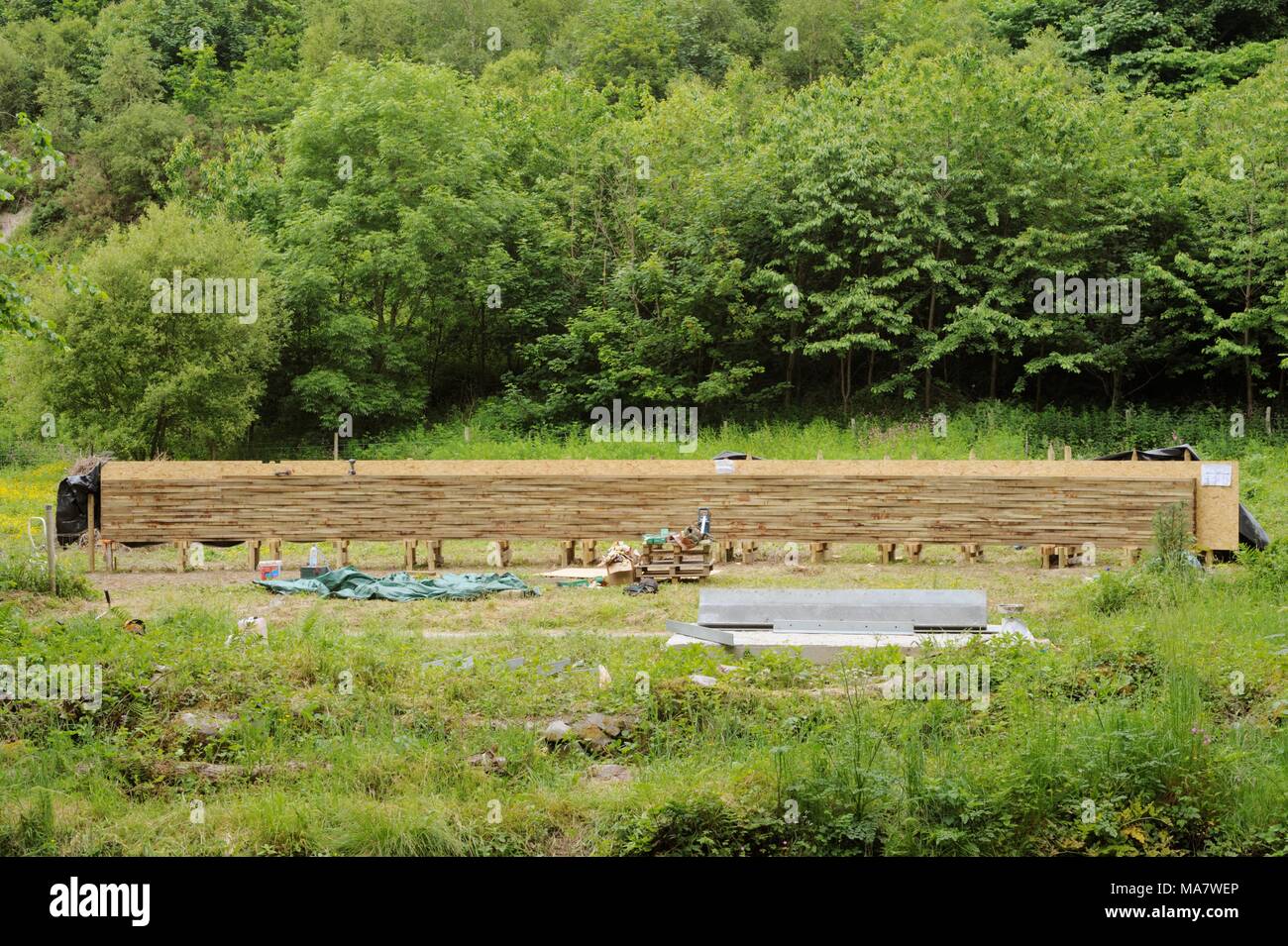 6 in a series of 32, building a timber footbridge. The completed arch ...