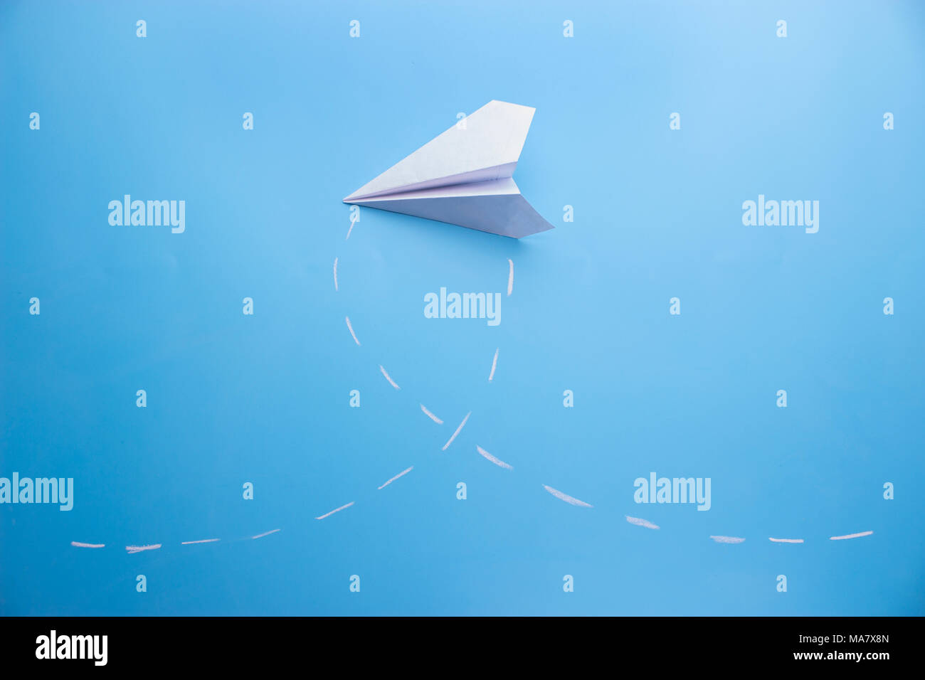 wooden plane performs a loop across blue background Stock Photo - Alamy