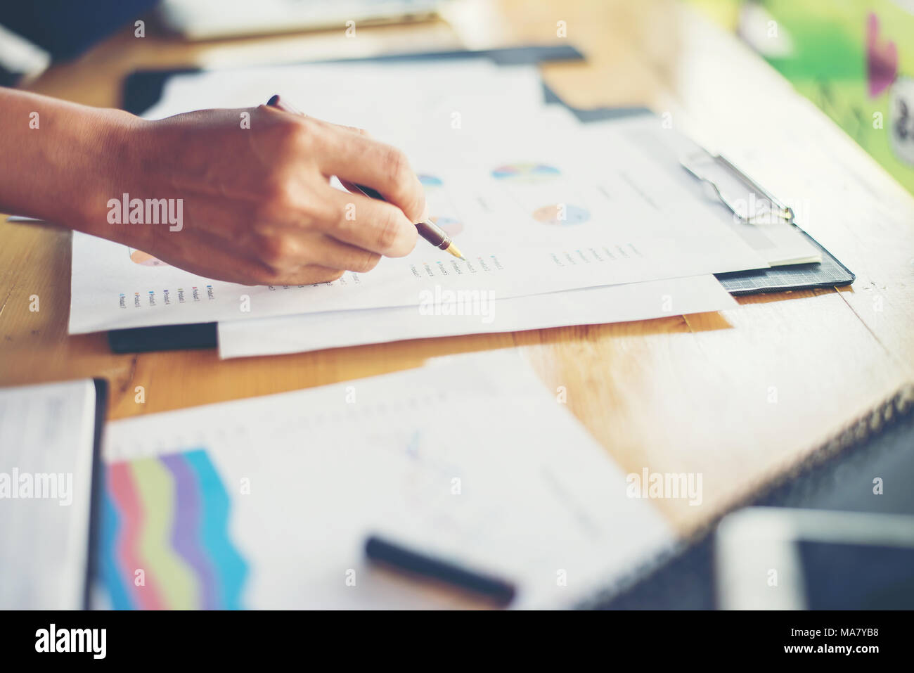 team business woman hands working and holding business graph ...