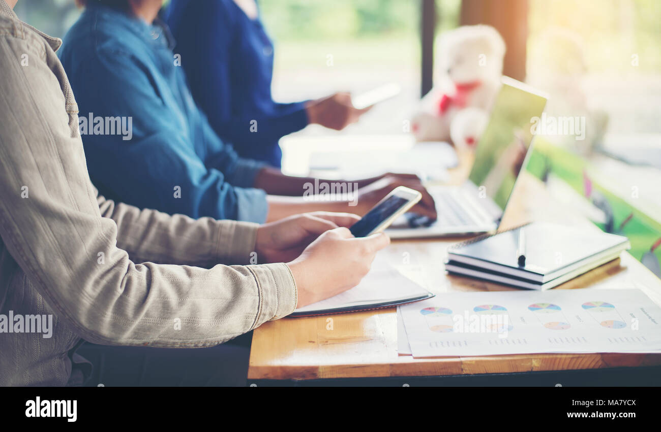 business woman hand working on smart phone with business graph ...